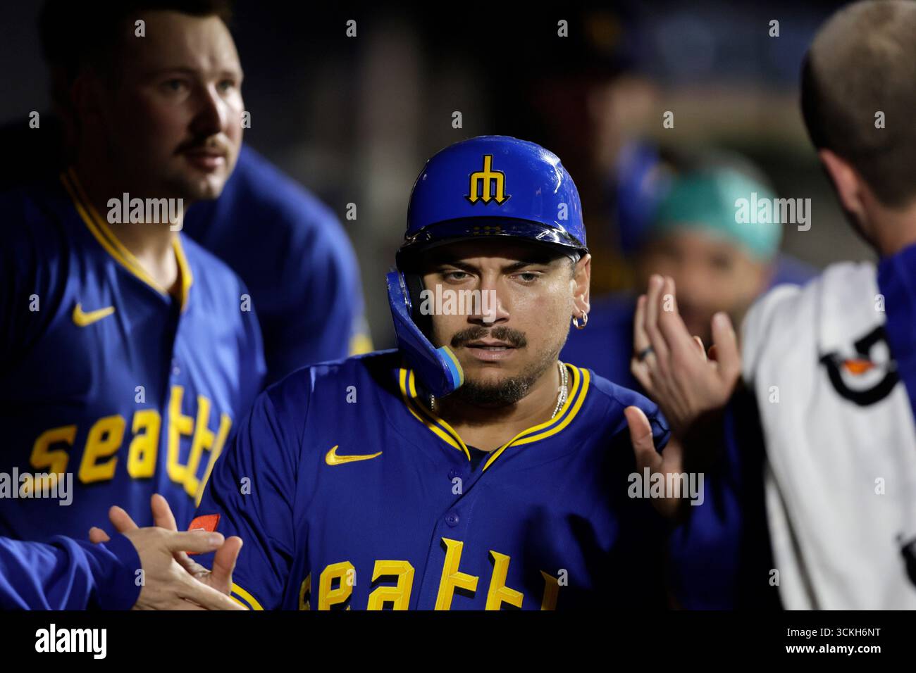 Seattle Mariners' Josh Naylor is greeted in the dugout after scoring ...
