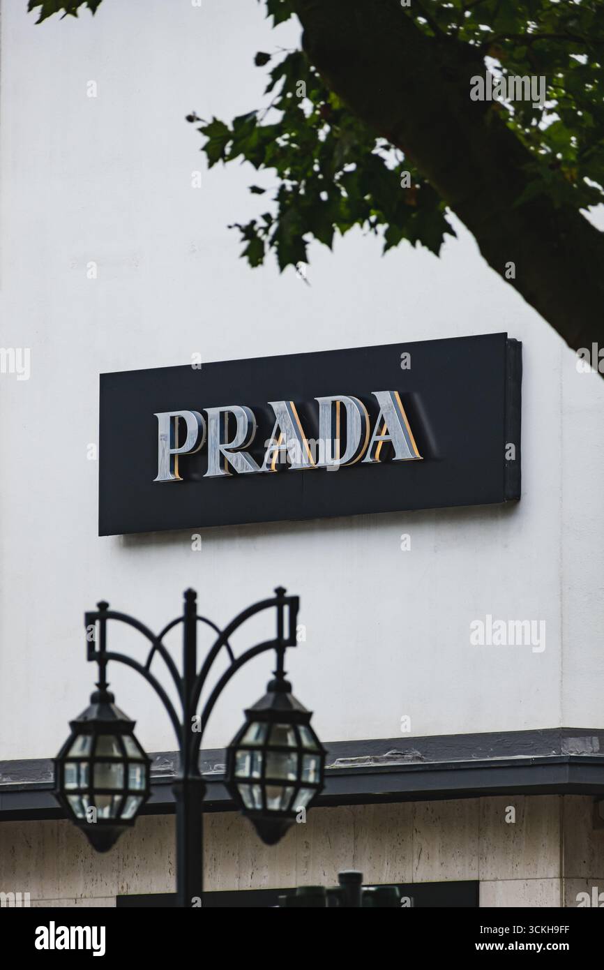 Prada luxury brand retail shop logo on the building wall Stock Photo ...