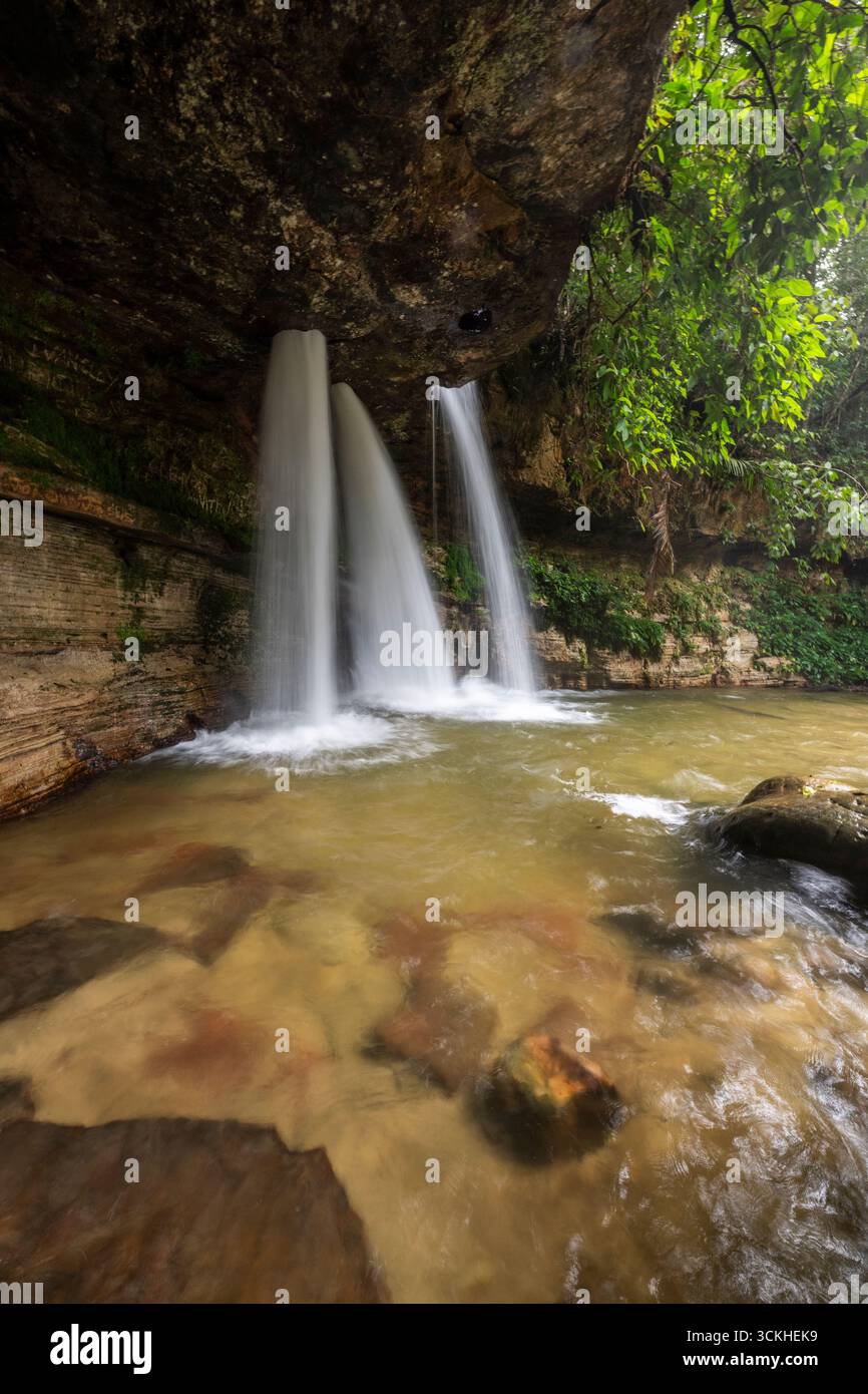 Beautiful view to water coming out of holes in Pedra Furada waterfall ...