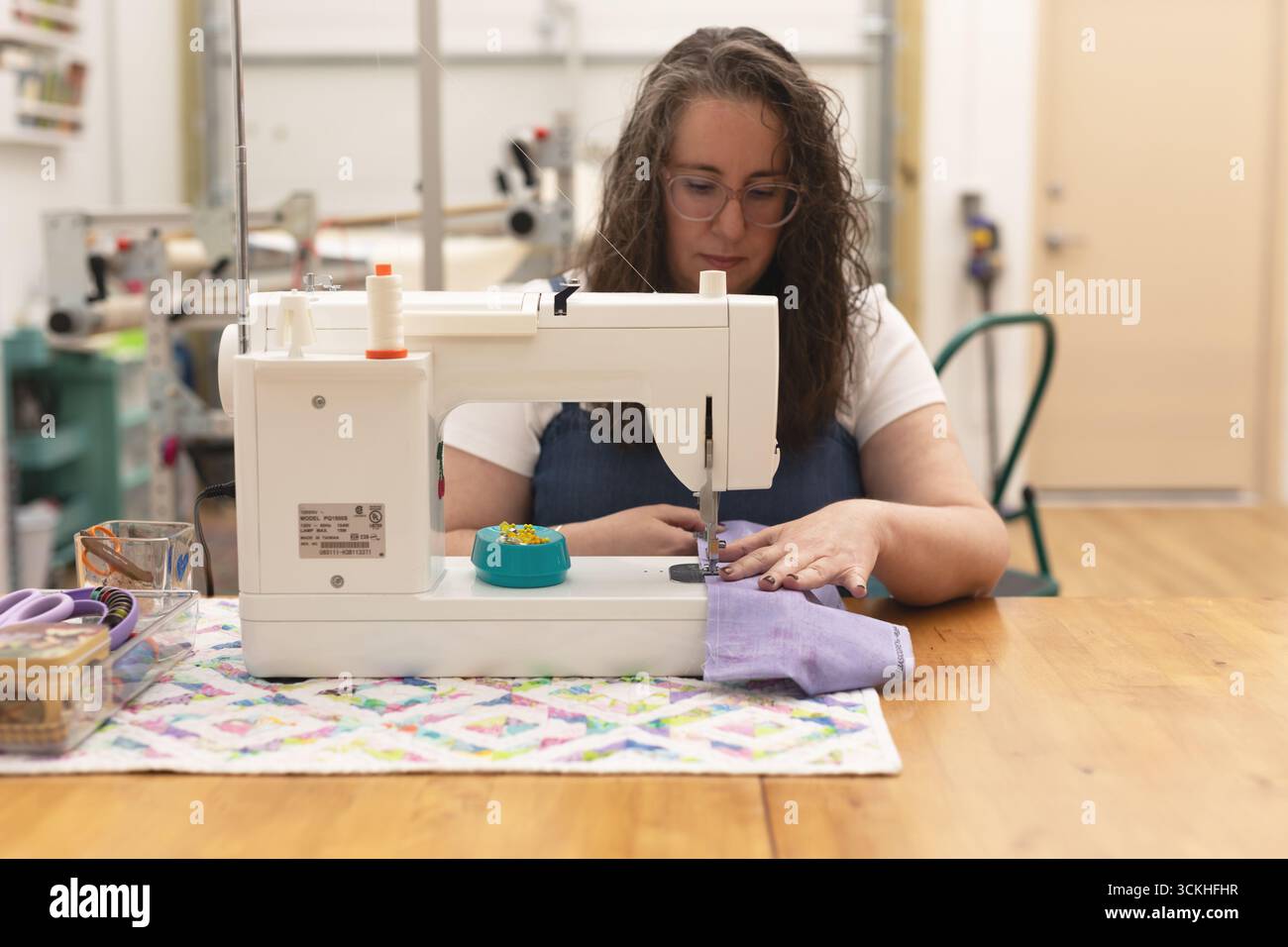 Woman hands sewing in studio hi-res stock photography and images - Alamy