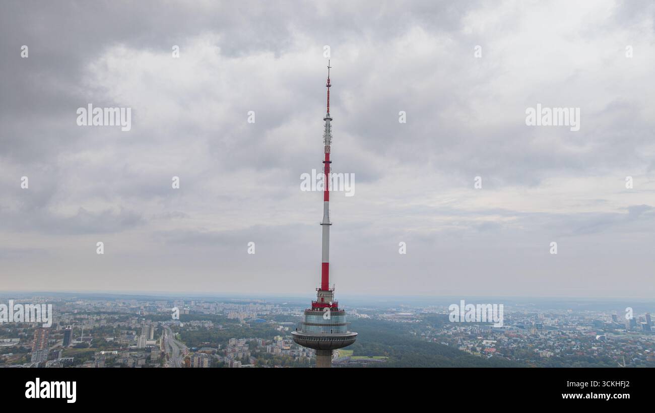 The Vilnius Television Tower stands tall with its red and white antenna ...