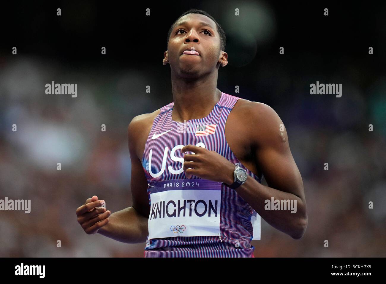FILE - Erriyon Knighton, of the United States, reacts following his men ...
