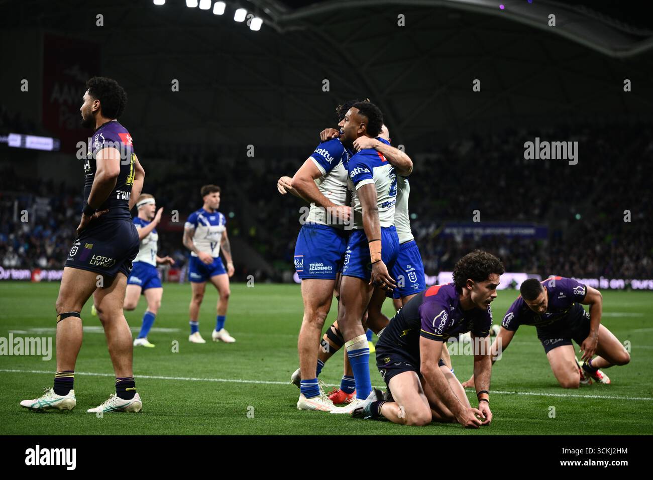 Matt Burton of the Bulldogs celebrates scoring a try during the NRL ...