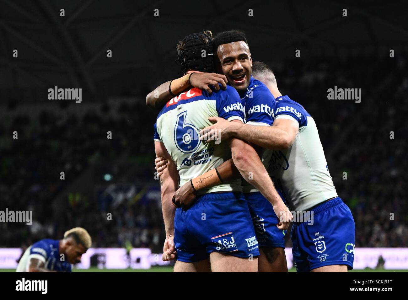 Matt Burton of the Bulldogs celebrates scoring a try during the NRL ...