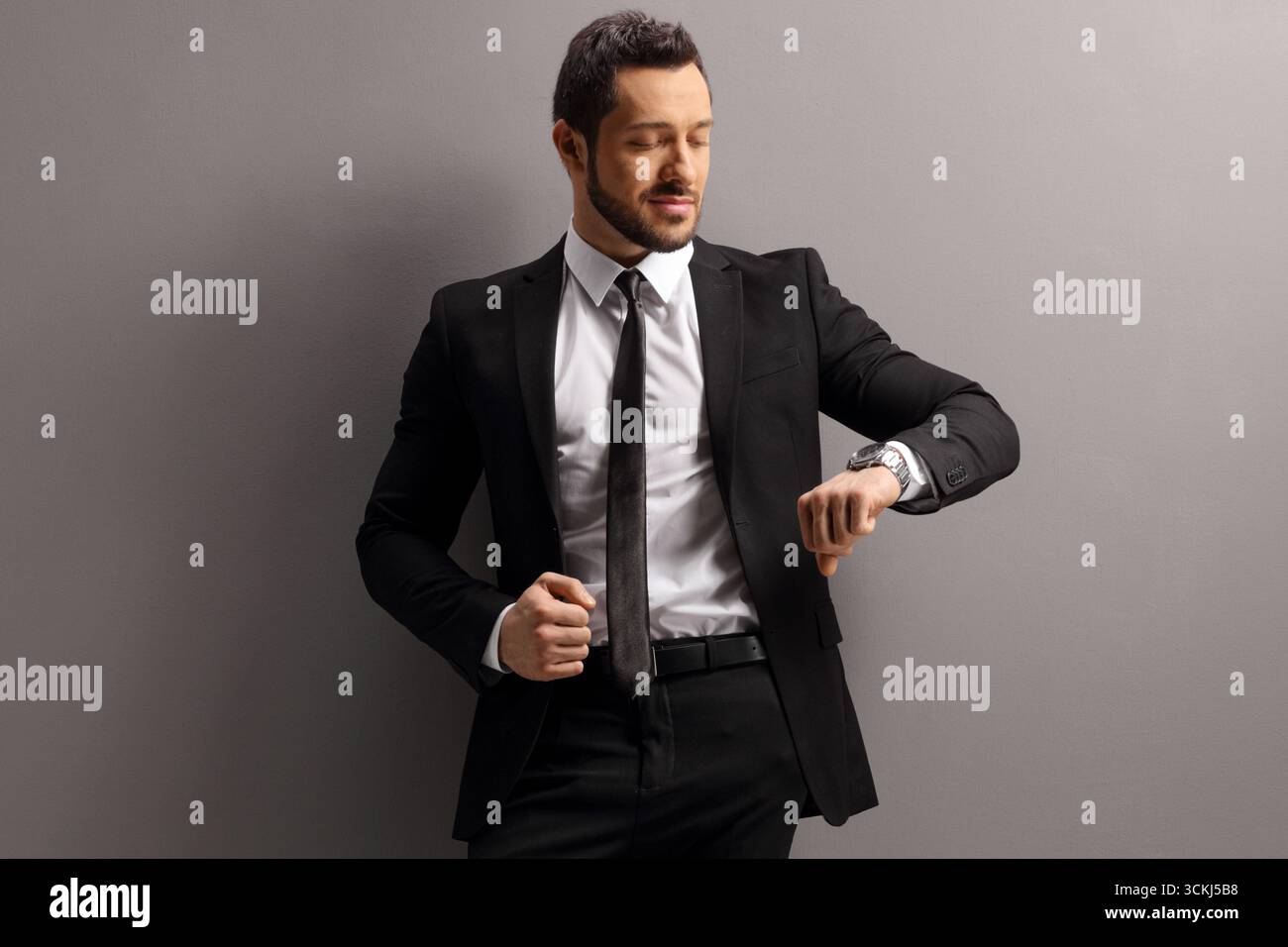 Male in suit checking hi-res stock photography and images - Alamy