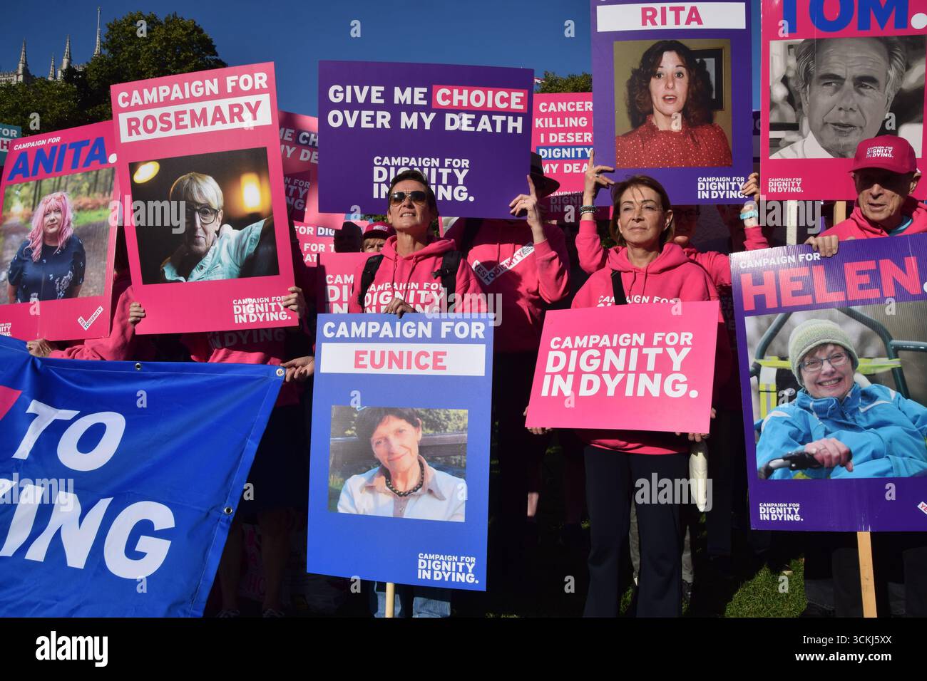 Protesters hold placards in support of the Assisted Dying Bill and ...