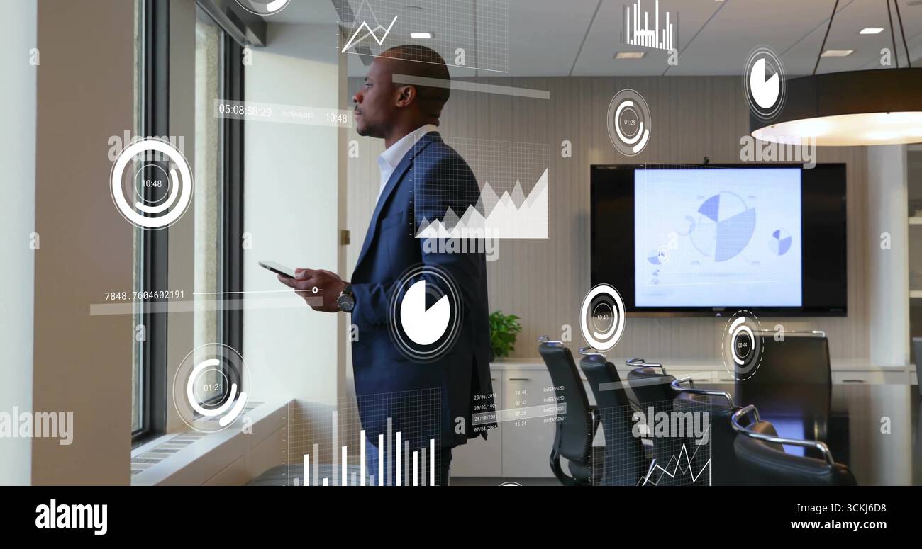 Gazing professional in suit holding smartphone in conference room by ...