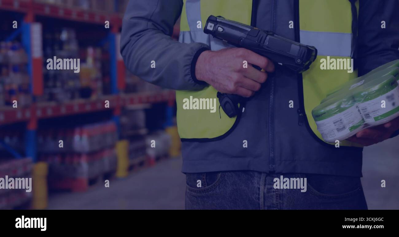 Scanning worker wearing safety vest using barcode scanner in storage ...