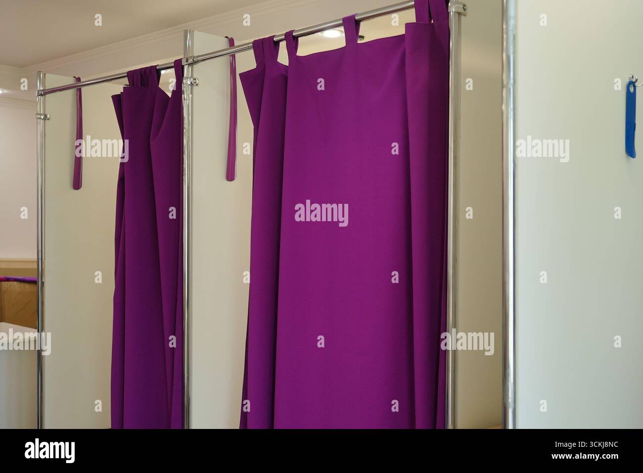 A row of dressing booths for trying on clothes in a store Stock Photo ...