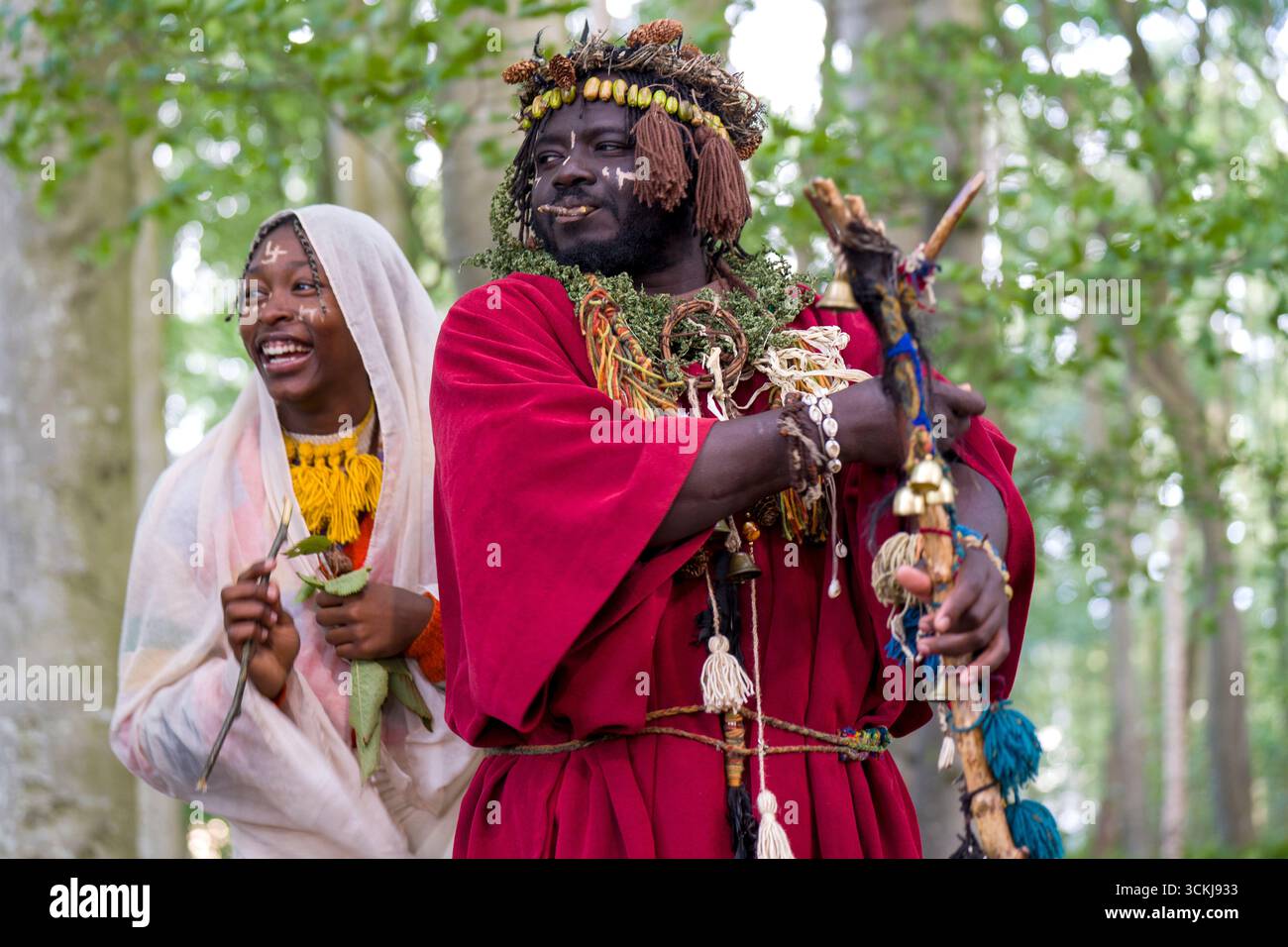 'King Atehene' with his handmaiden 'Asnat', at their campsite in woods ...
