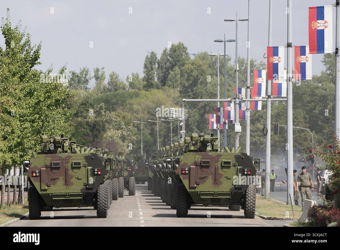 Serbian Army armored vehicles drive ahead of a military parade ...