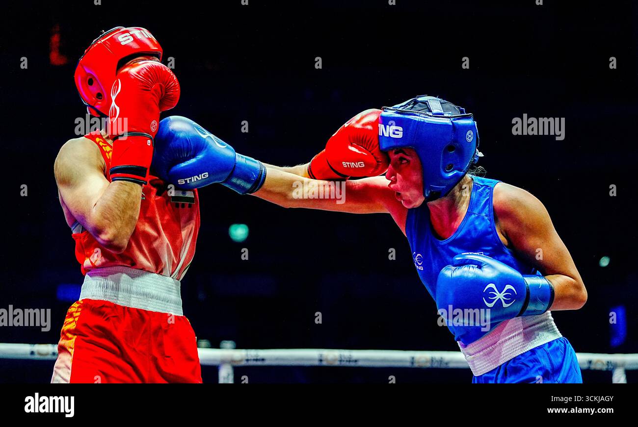England's Alice Pumphrey (Blue) and India's Minakshi Minakshi (Red ...