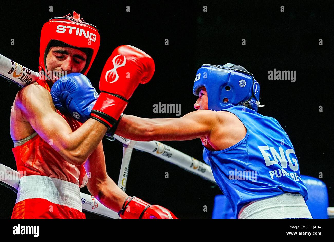 England's Alice Pumphrey (Blue) and India's Minakshi Minakshi (Red ...