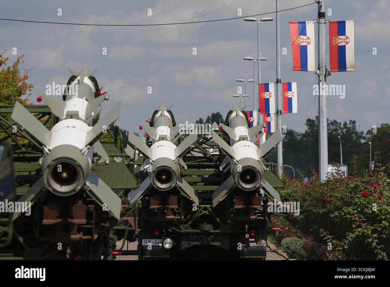 An anti-aircraft rocket system drives ahead of a military parade ...