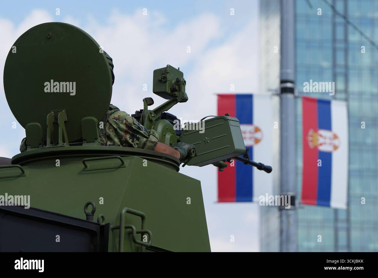 Serbian Army vehicles drive ahead of a military parade scheduled for ...