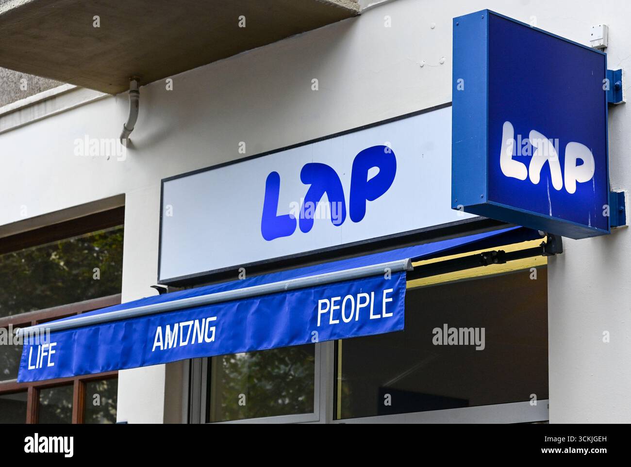 12 September 2025, Berlin: Logos of the Lap Coffee chain are attached ...
