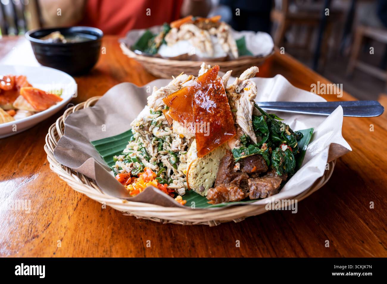 Roasted pork with rice and vegetables or nasi campur babi guling ...