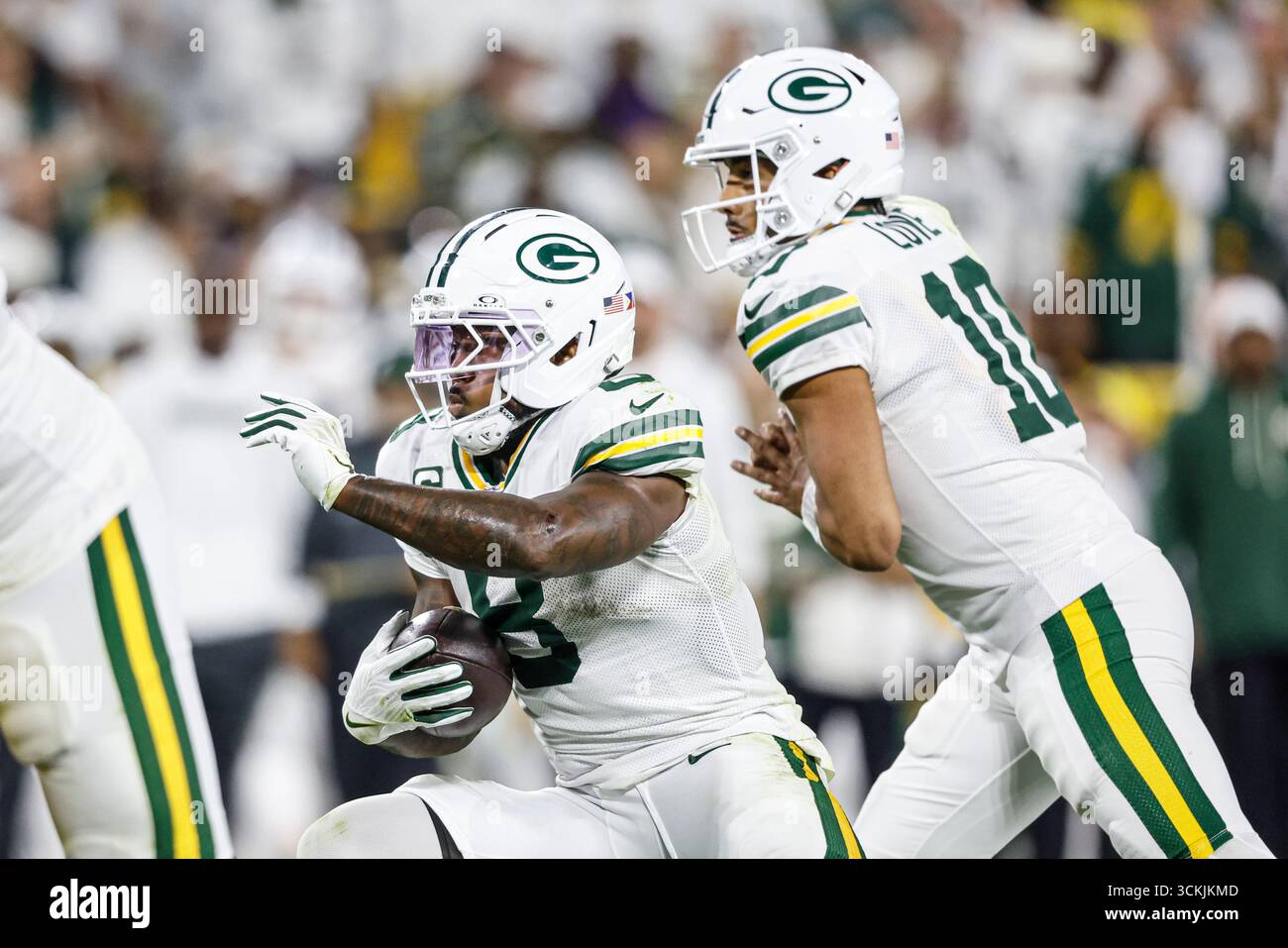 Green Bay Packers running back Josh Jacobs (8) runs with the ball ...