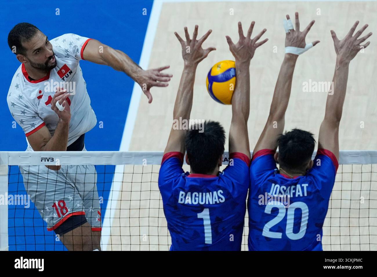 Ali Bongui, left, of Tunisia shot is blocked by Bryan Bagunas of the ...