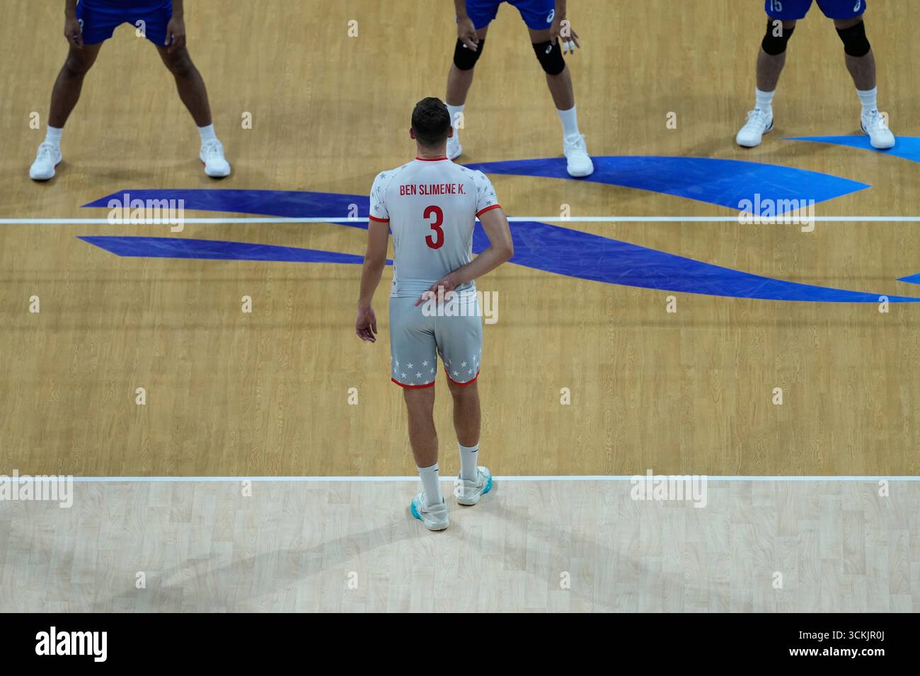 Khaled Ben Slimene of Tunisia signals to his team during their match ...