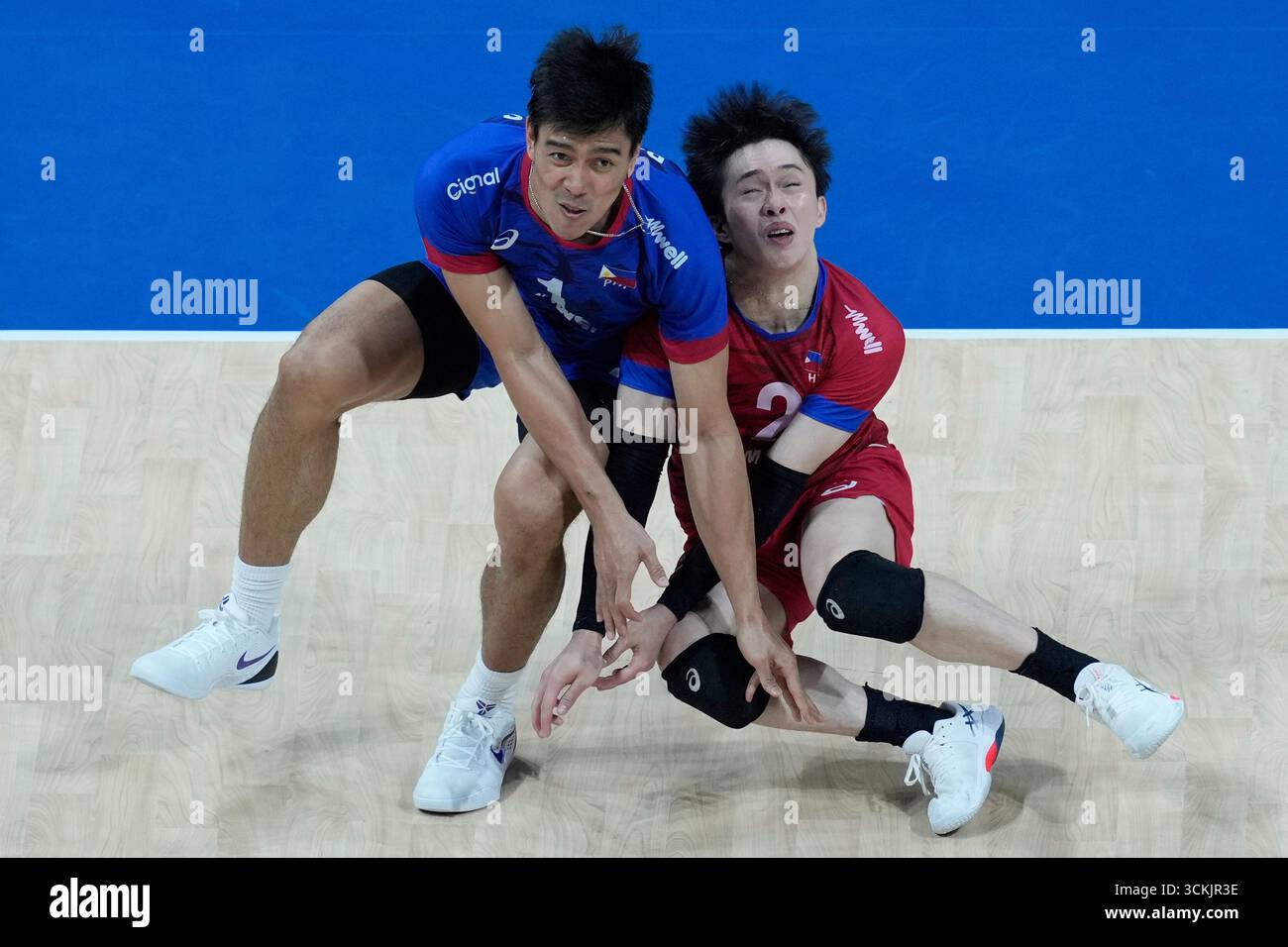Philippines Bryan Bagunas, left, and Josh Ybanez collide as they try to ...