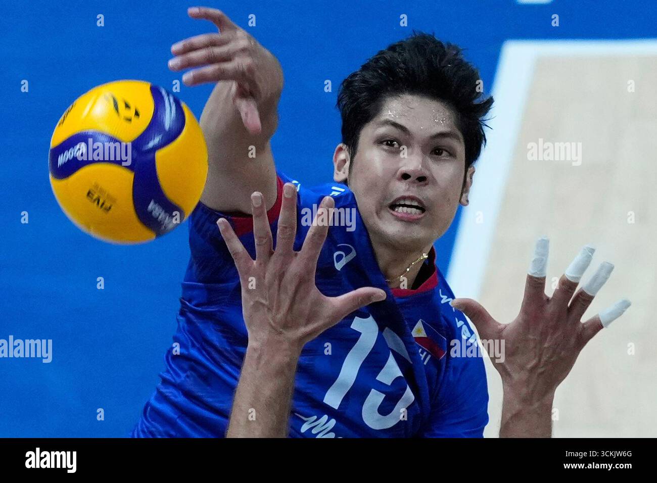 Marck Jesus Espejo of the Philippines spikes the ball against Elyes ...