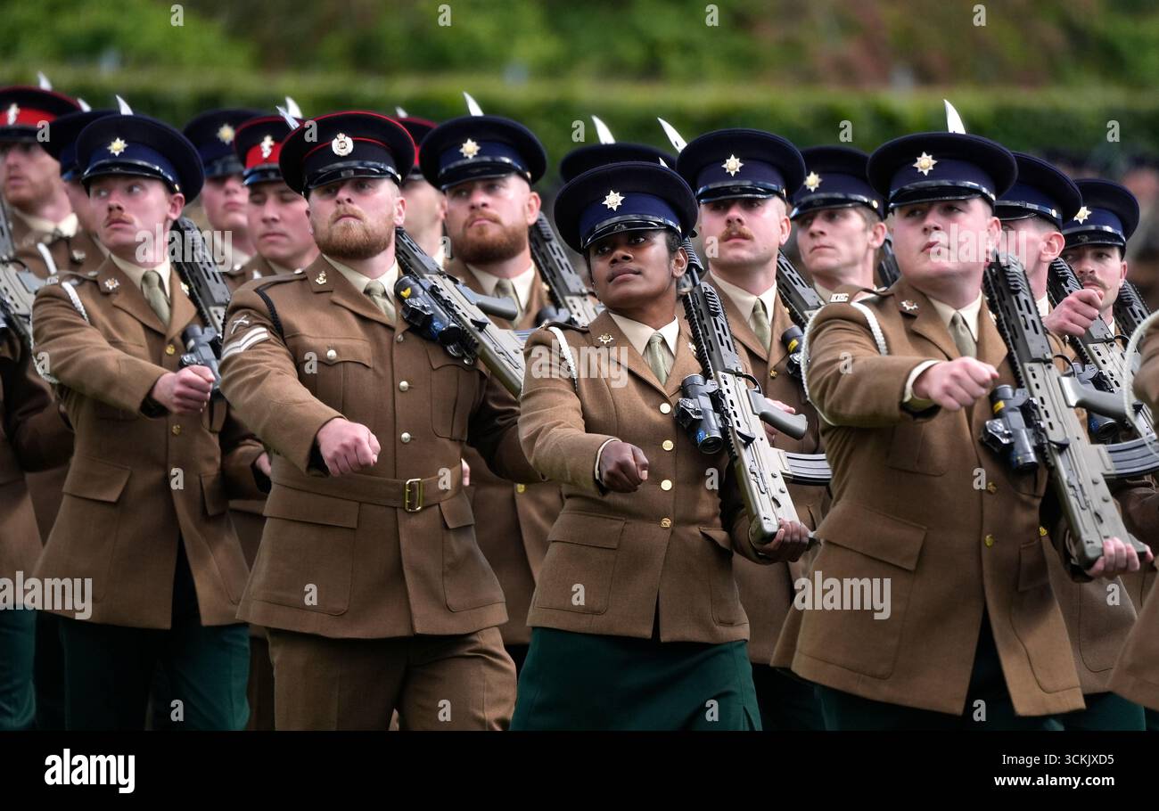 Members of the Royal Dragoon Guards march past the dais during a visit ...