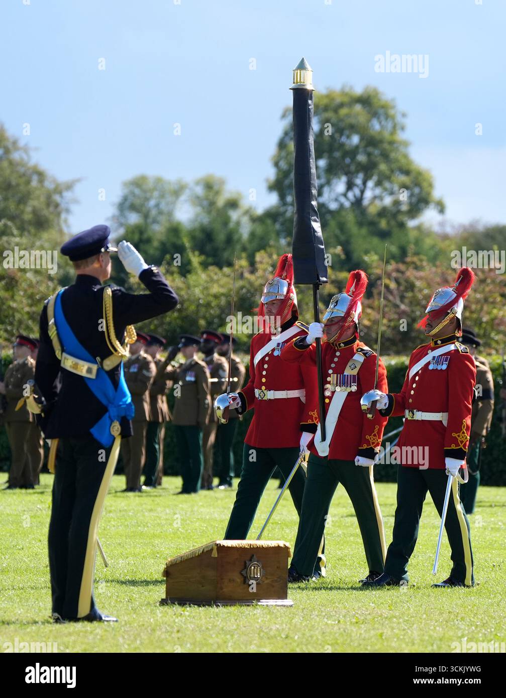 The Duke of Edinburgh salutes as the Royal Dragoon Guards standard ...