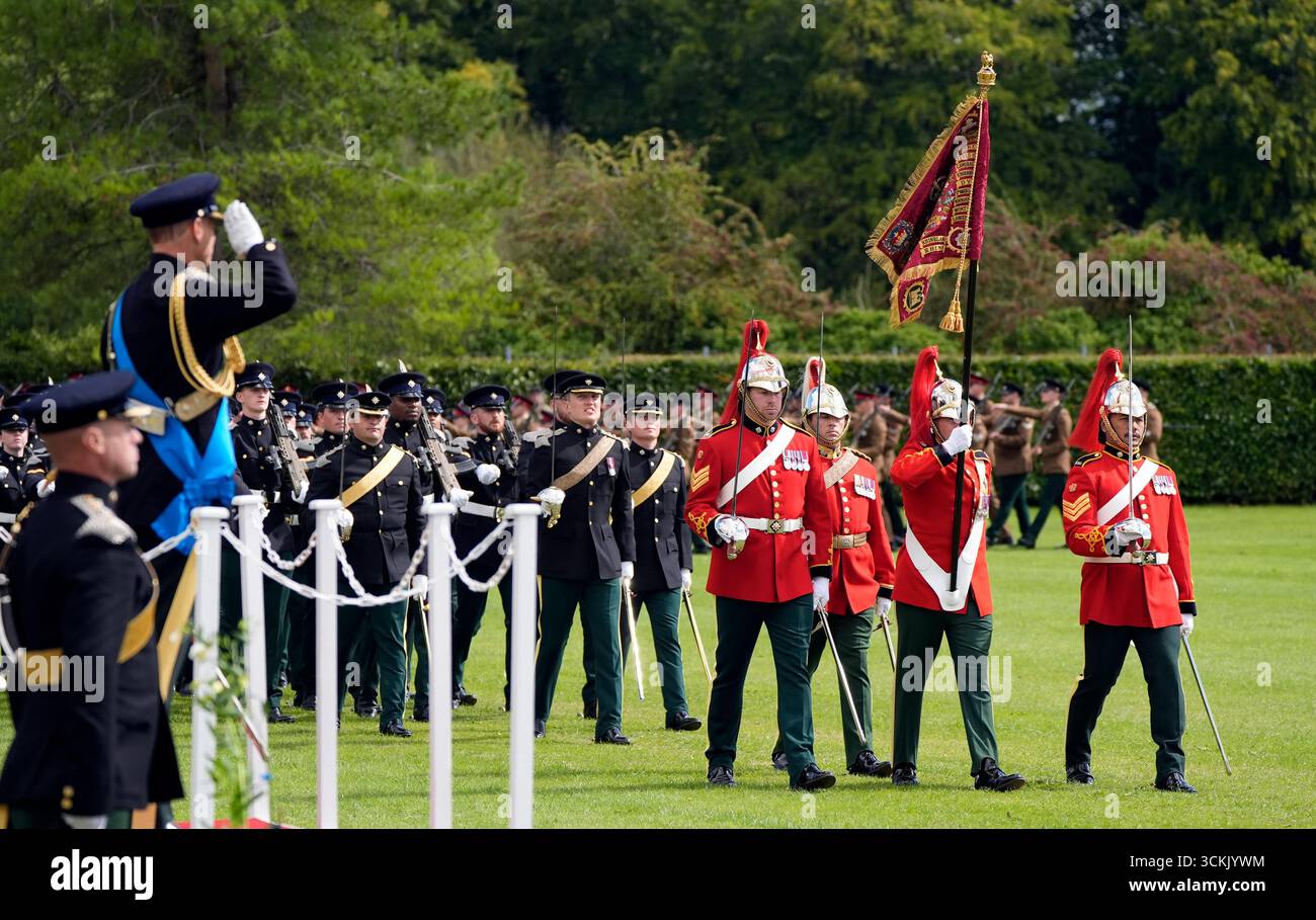 The Duke of Edinburgh salutes as the Royal Dragoon Guards standard ...