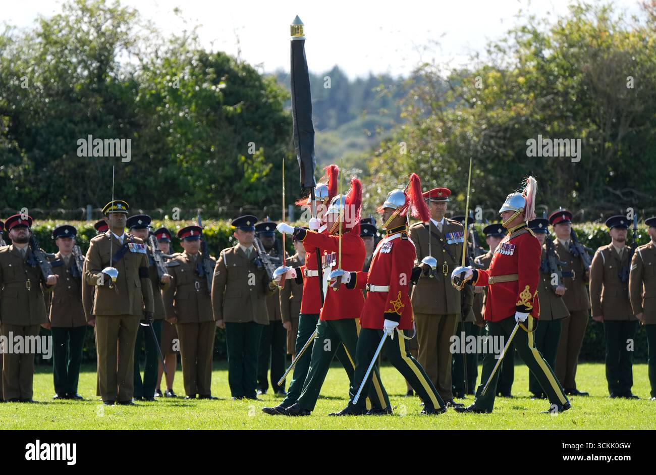 The new standard for the Royal Dragoon Guards is paraded ahead of the ...