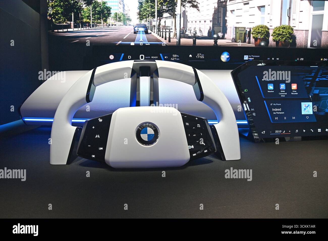 BMW booth with an oversized, fully digital cockpit and steering wheel ...