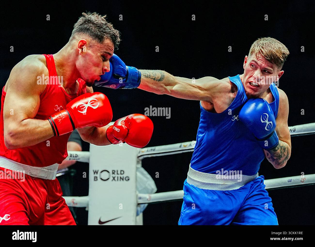 Scotland's Robert McNulty (Blue) and Austria's Michael Derouiche (Red) fight in the Men's 85Kg ...