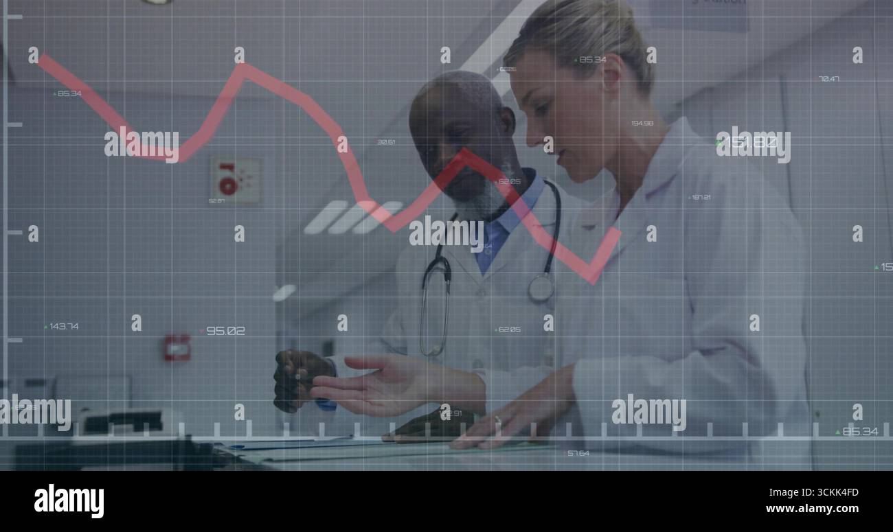 Reviewing data doctors using touchscreen table in hospital corridor ...
