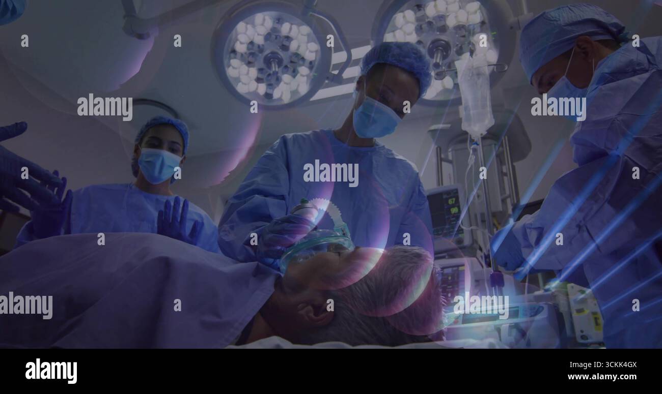 Performing surgery lead surgeon guiding team around patient in ...