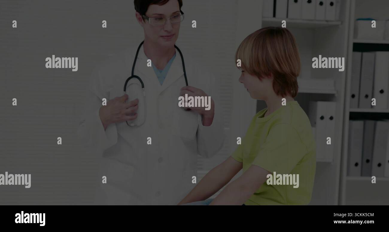 Adjusting stethoscope female doctor engaging boy patient at clinic exam ...