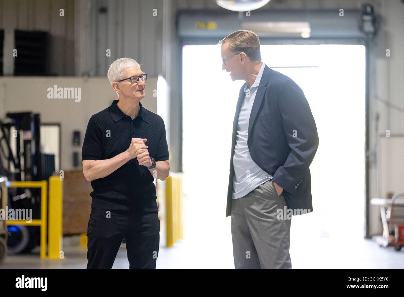 Apple CEO Tim Cook and Corning CEO Wendell Weeks speak during a tour of ...
