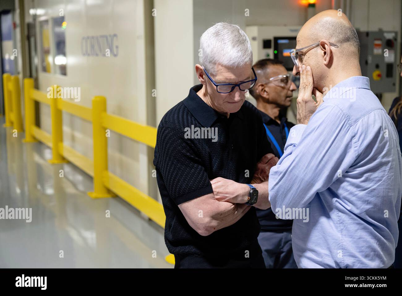 Apple CEO Tim Cook is seen during a tour of Corning's iPhone glass ...