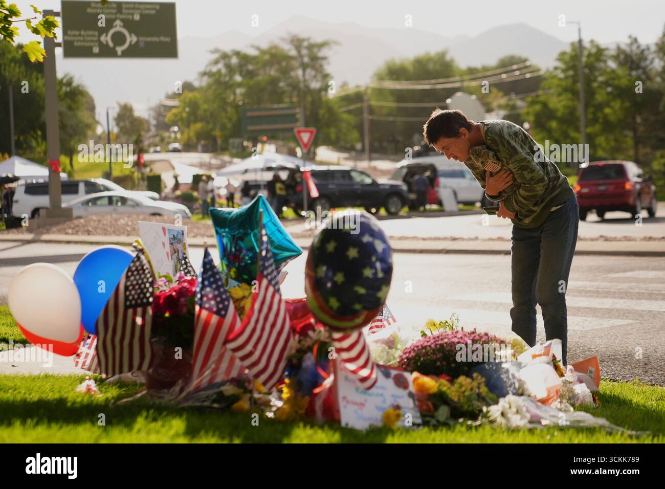 Wendy Lucas, Utah Valley University student looks at a memorial set up ...