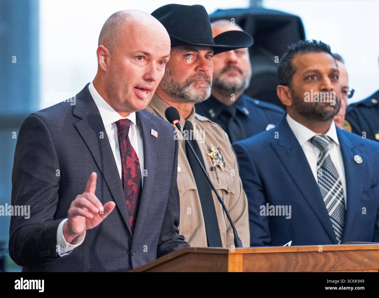 Utah Governor Spenser Cox (L) stands with FBI Director Kash Patel (R ...