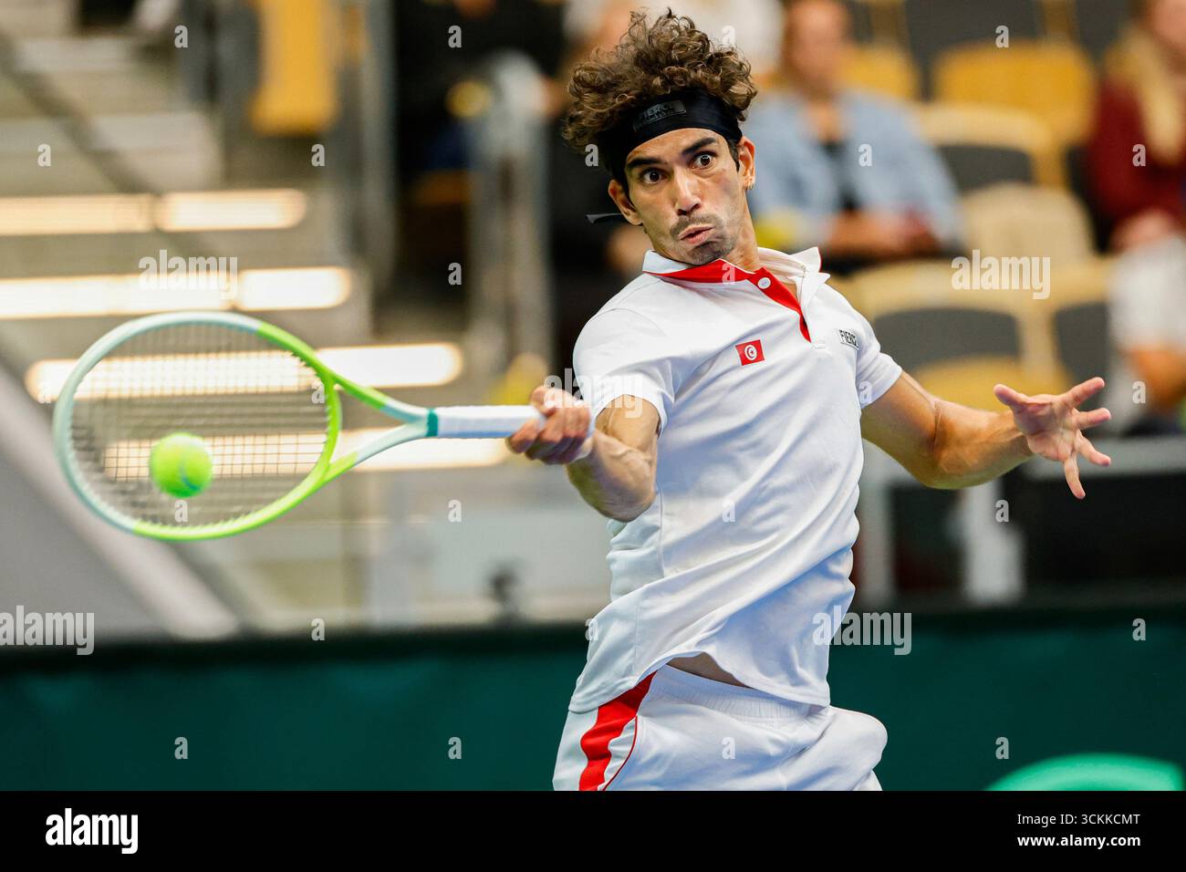 Tunisia's Moez Echargui hits a return during a Davis Cup tennis match ...