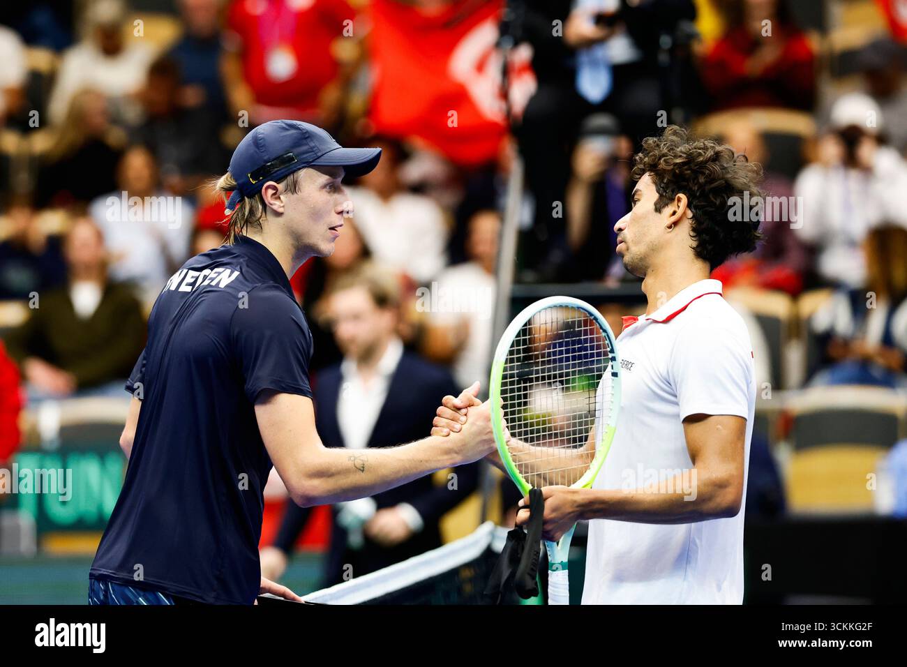 Sweden's Leo Borg, left, and Tunisia's Moez Echargui shake hands after ...