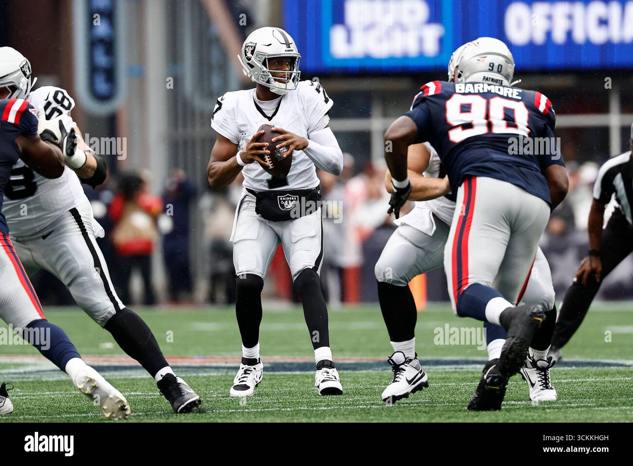 Las Vegas Raiders quarterback Geno Smith drops back against the New ...
