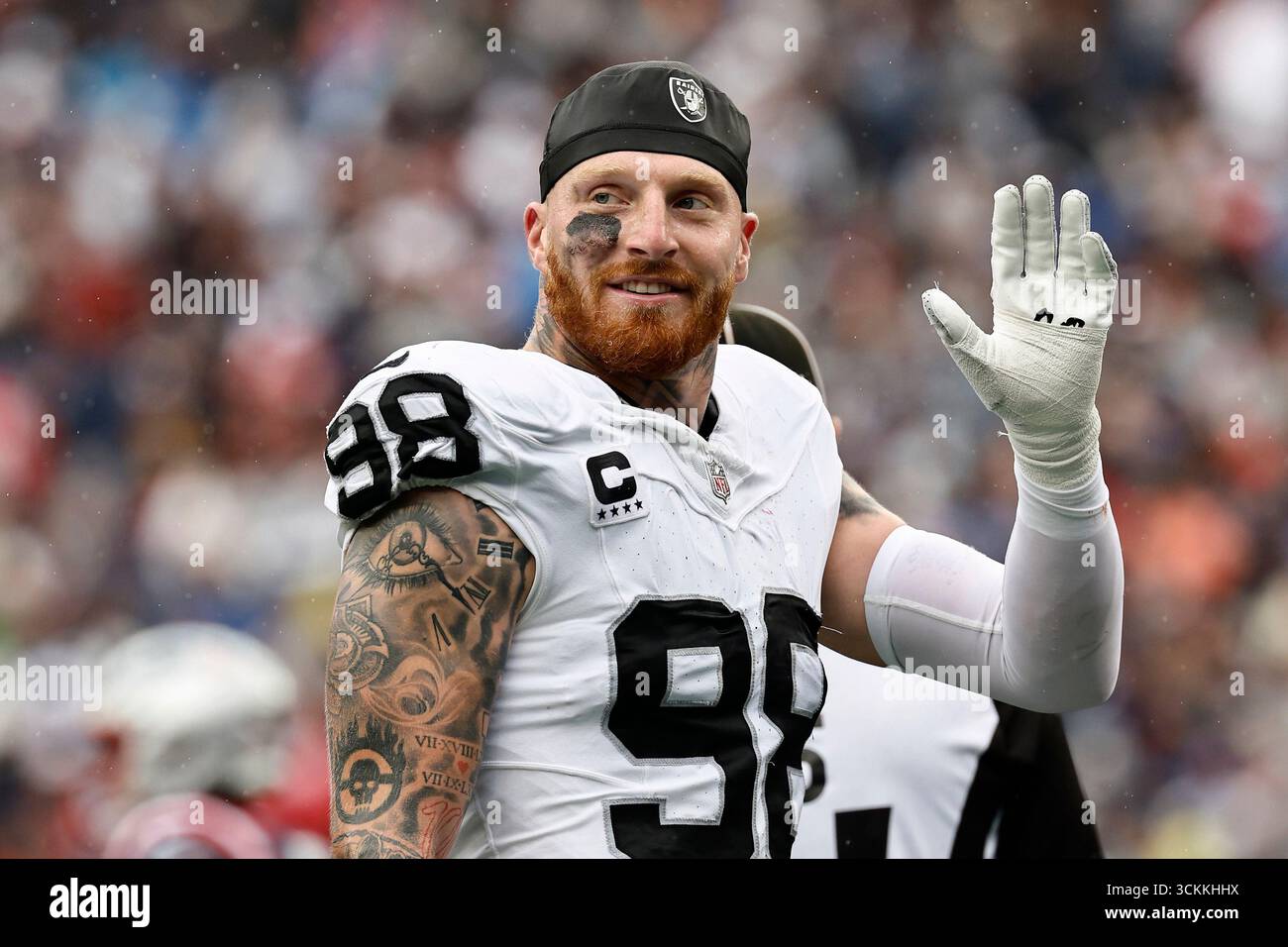 Las Vegas Raiders' Maxx Crosby smiles and waves to fans during an NFL ...
