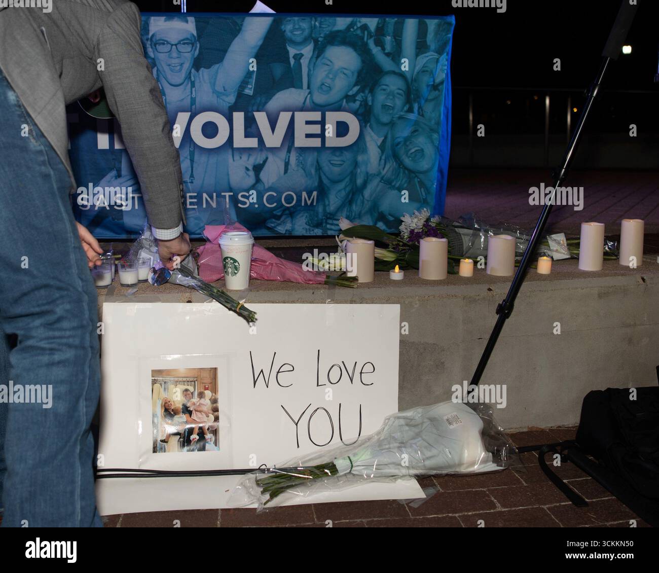 A button and flowers are added to the memorial vigil for Charlie Kirk ...