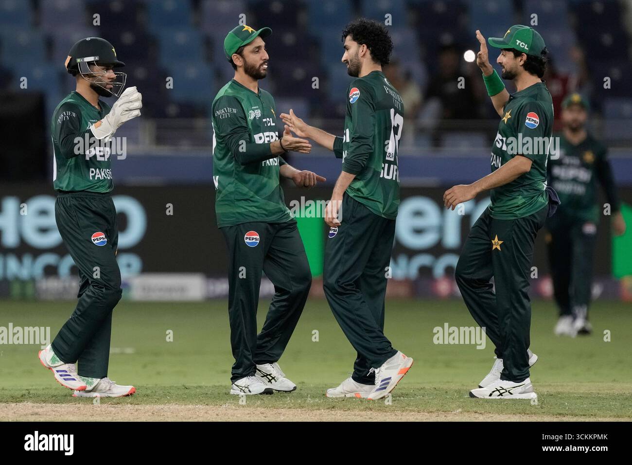 Pakistan's Sufiyan Muqeem, second right, celebrates with teammates ...