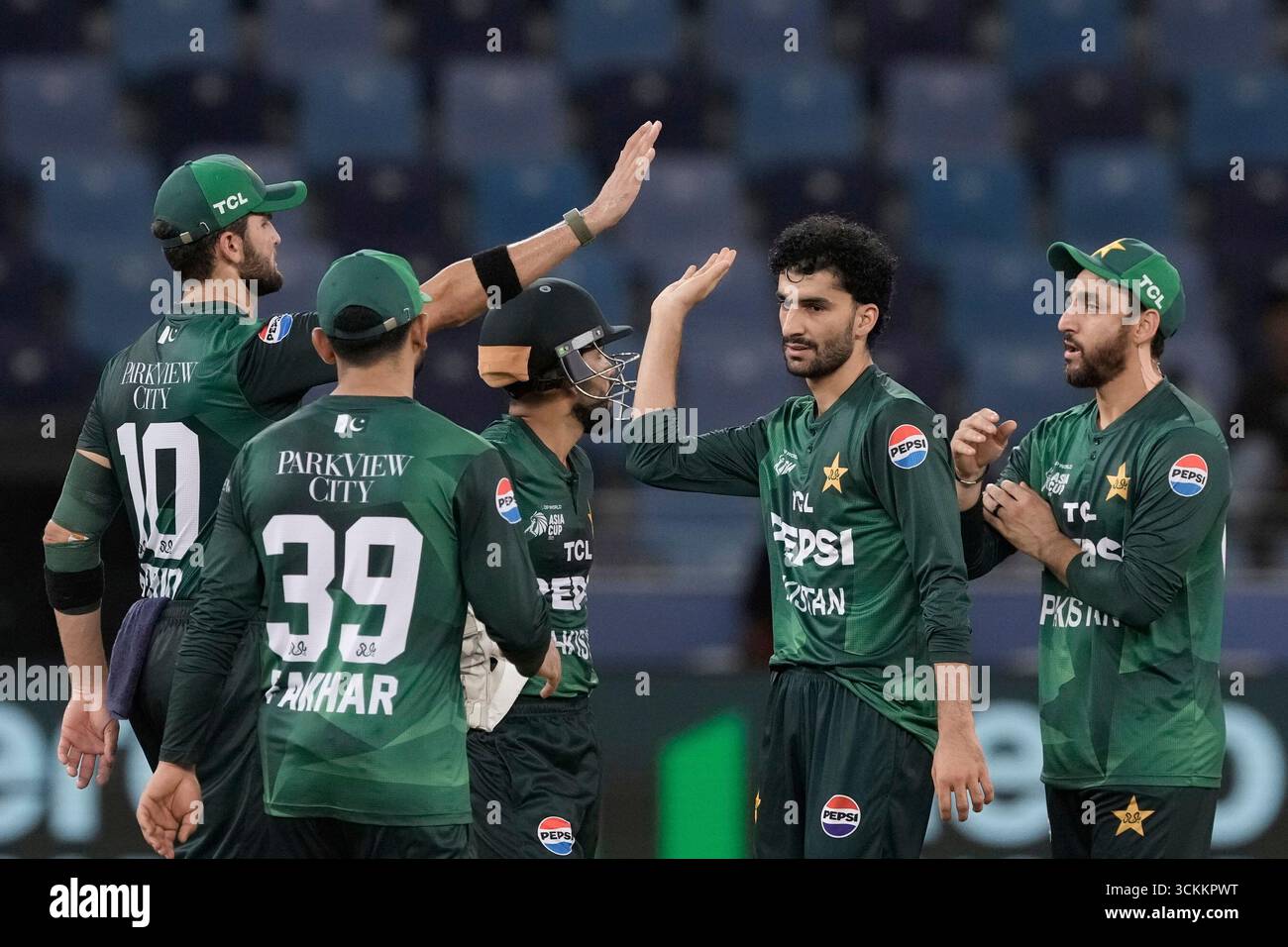Pakistan's Sufiyan Muqeem, second right, celebrates with teammates ...