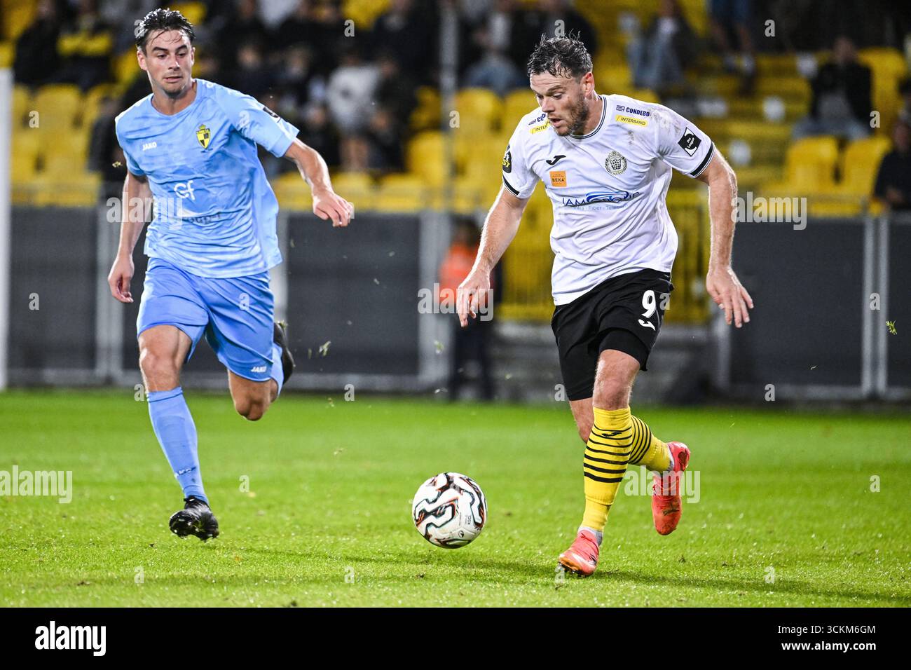 Lierse's Bo De Kerf and Lokeren's Tom Boere pictured in action during a ...