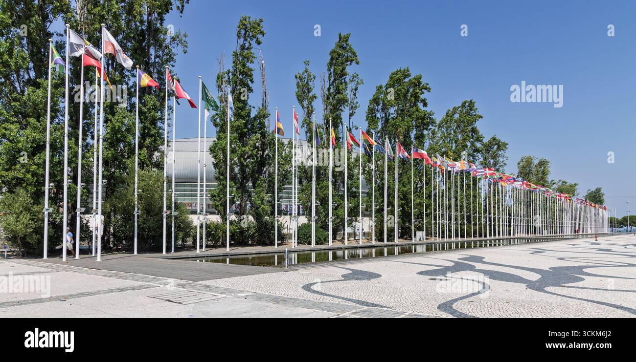A long line of flags from various nations flies at the site of Expo '98 ...