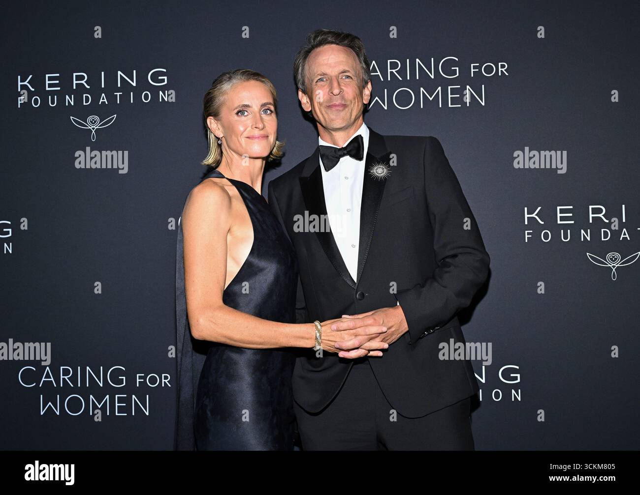 Alexi Ashe, left, and Seth Meyers attend the Kering Caring for Women ...