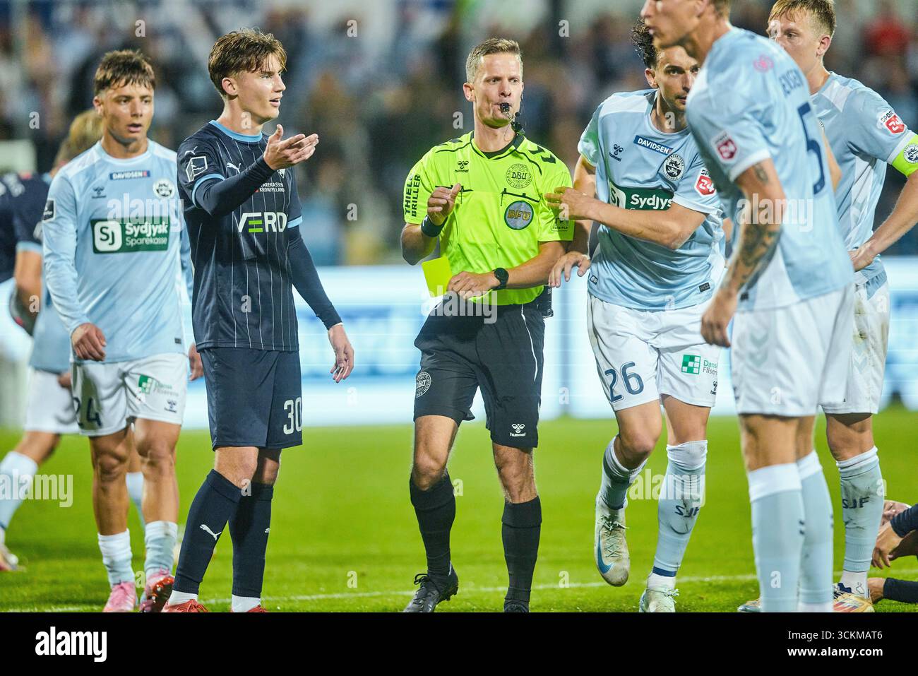 Referee Jonas Hansen gives a yellow card during the Super League match ...